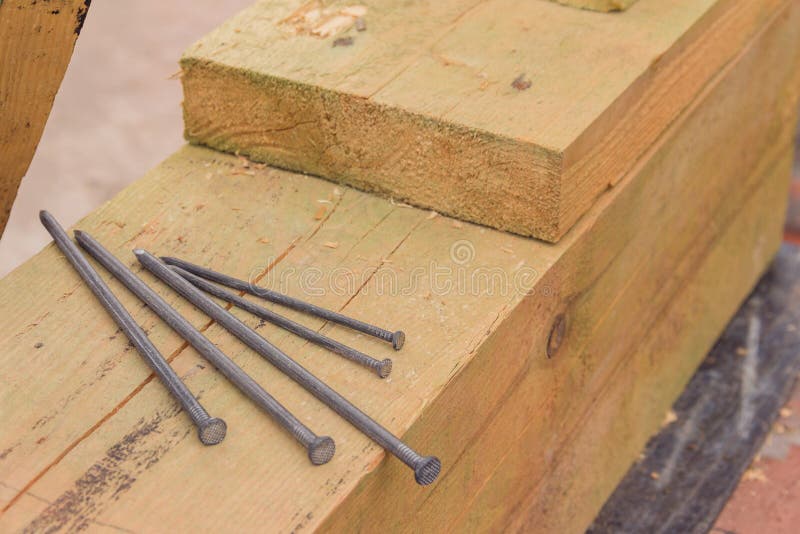 Construction Nail. a Large Nail Lies on a Concrete Base Stock Photo ...