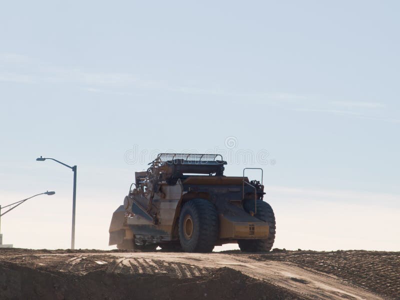Wheel tractor-scraper stock photo. Image of dirt, earth - 283722374