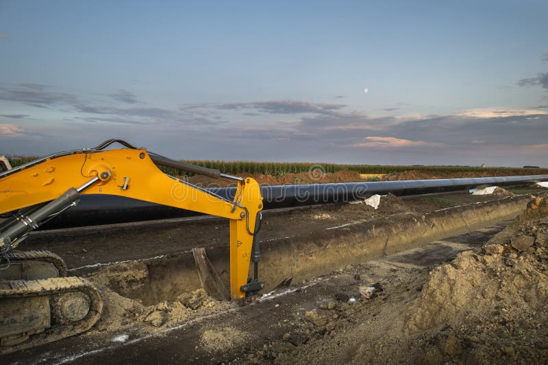 Crane Digging a Channel for Gas Pipeline Stock Image - Image of digging ...