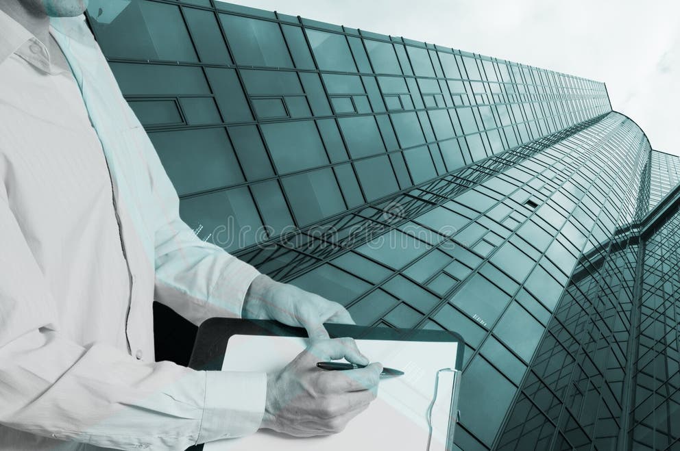 Construction of a New Glass Building with the Tablet Stock Photo ...