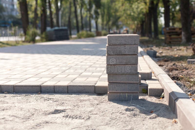 Construction of a New Pavement of Paving Slabs Closeup Detail. Pavement ...