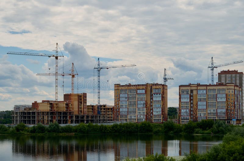 Construction of New Residential Buildings: Construction Site with Crane ...