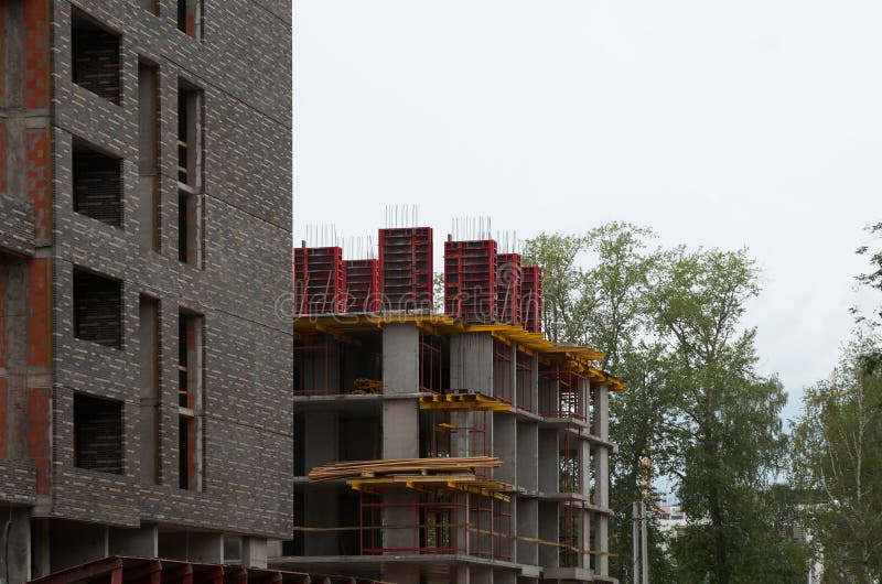 Construction of New Residential Buildings: Construction Site with Crane ...