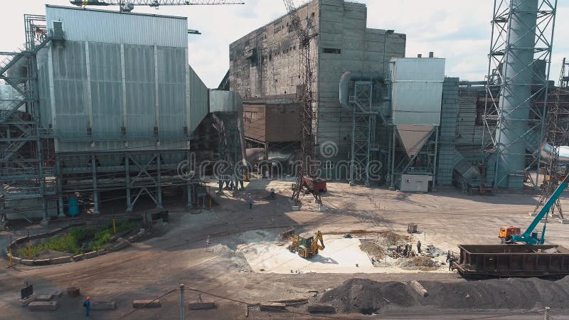 Fly Over a Construction Site at a Factory. Construction Machinery on ...