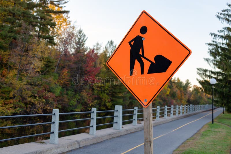 Construction: Orange Excavator in the Middle of a Large Construction ...