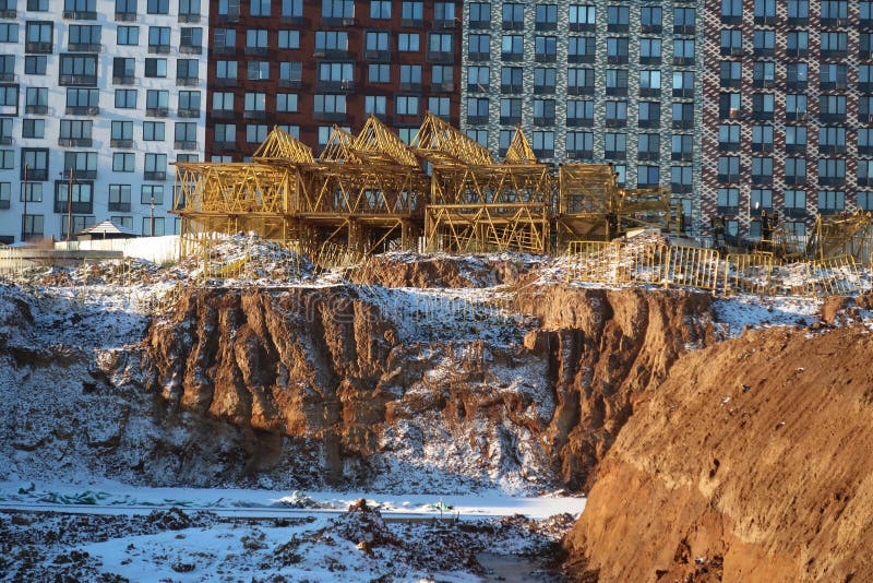 Construction Pit and Scaffolding on the Background of Residential ...
