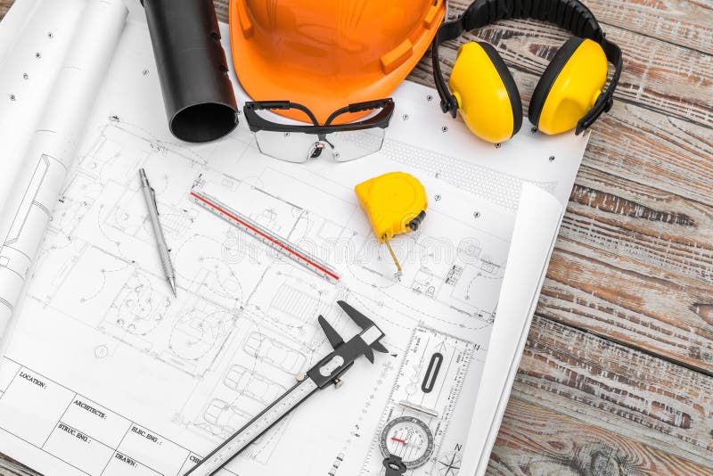 Construction Plans with Helmet and Drawing Tools on Blueprints . Stock ...