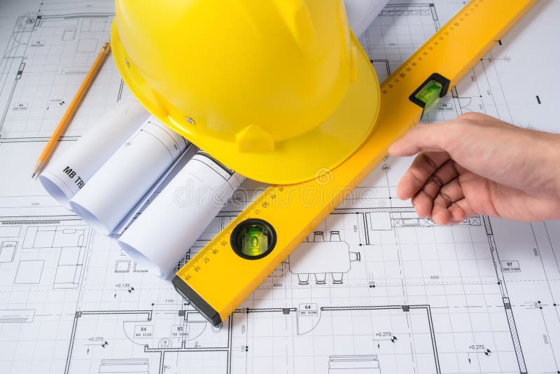 Construction Plans with Helmet and Drawing Tools on Blueprints Stock ...