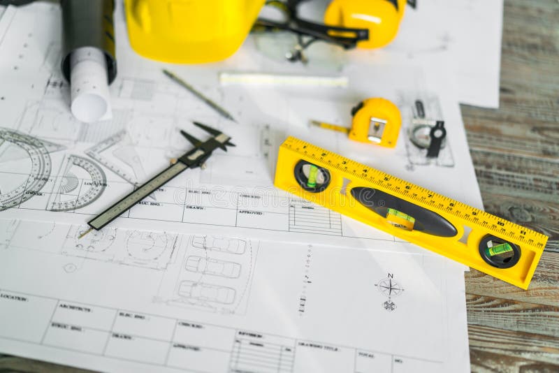 Construction Plans with Helmet and Drawing Tools on Blueprints . Stock ...