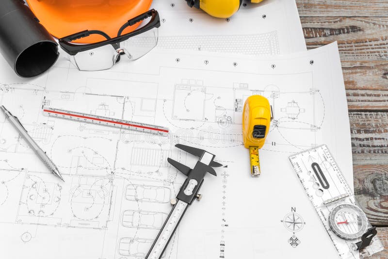 Construction Plans with Helmet and Drawing Tools on Blueprints . Stock ...