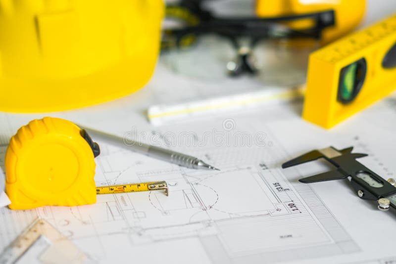 Construction Plans with Helmet and Drawing Tools on Blueprints . Stock ...