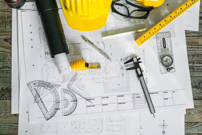 Construction Plans with Helmet and Drawing Tools on Blueprints . Stock ...