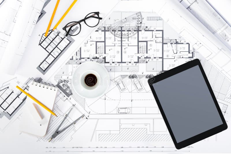 Construction Plans with Tablet and Drawing Tools on Blueprints Stock ...