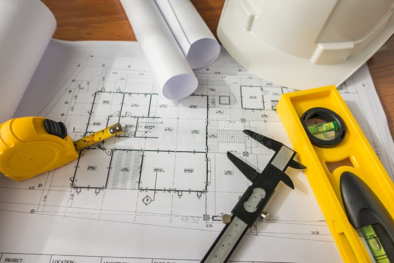 Construction Plans with White Helmet and Drawing Tools on Blueprints ...