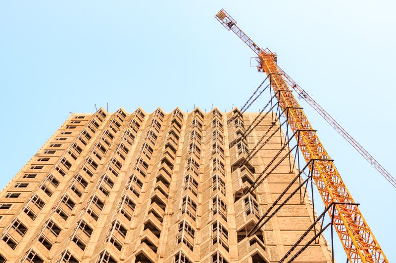 Tower Crane Attached To Concrete Building During Construction. Stock ...