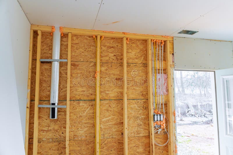 Construction Process Showing Wall Framing and Insulation in a ...