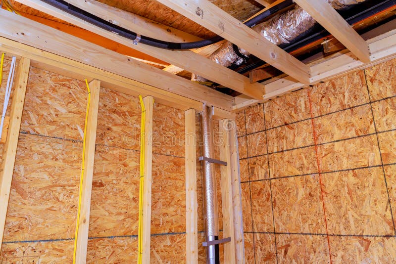 Construction Progress Highlighting Wooden Framework and Insulation in a ...