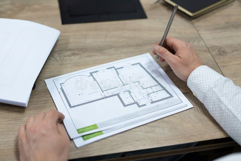 Construction Project Drawings are Discussed by Construction Company ...
