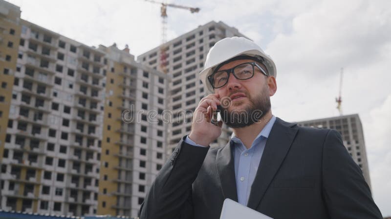 Project Manager on Call at Construction Site Stock Video - Video of ...