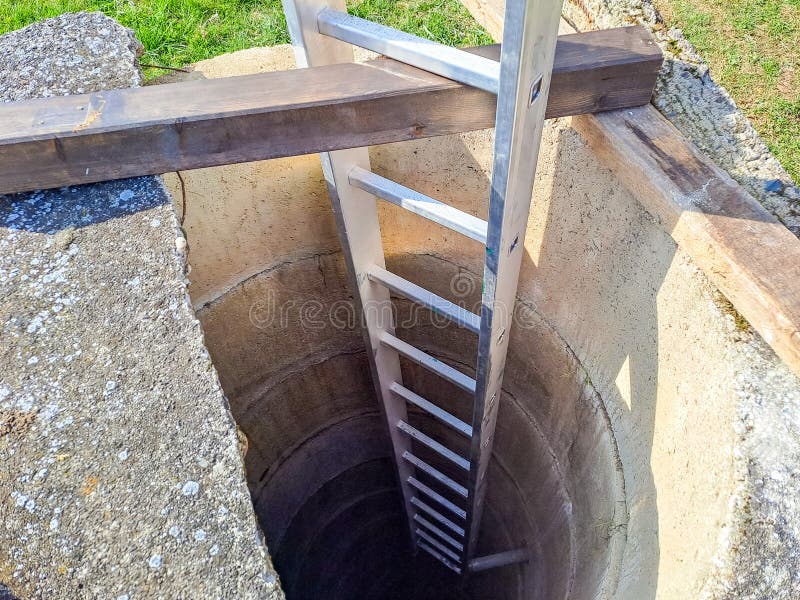 Descent into a Deep Pit during the Construction of the Building. Safety ...