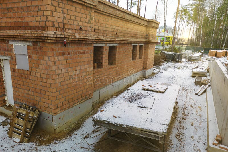 Construction of Red Brick Walls in Winter. Construction Site ...