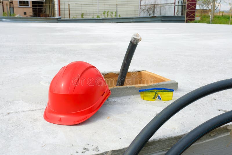 The Construction Red Helmet is on the Construction Site. Safety Helmet ...