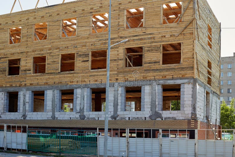 Construction of a Residential Building Made of Bricks and Wooden Logs ...