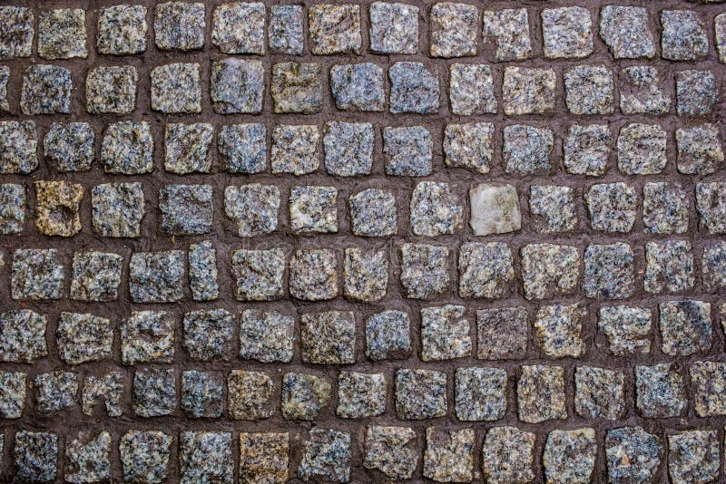 Construction of a Road from a Beautiful Wet Granite Stone Stock Photo ...