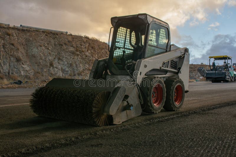 Construction of a Road Leveling and Cleaning the Recent Asphalt Stock ...