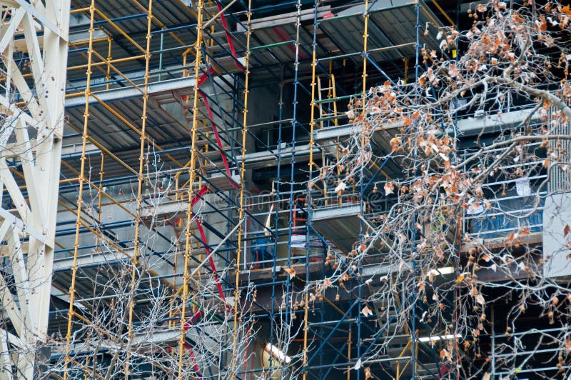 Construction Scaffolding of High-rise Building and Dried Leaves Stock ...