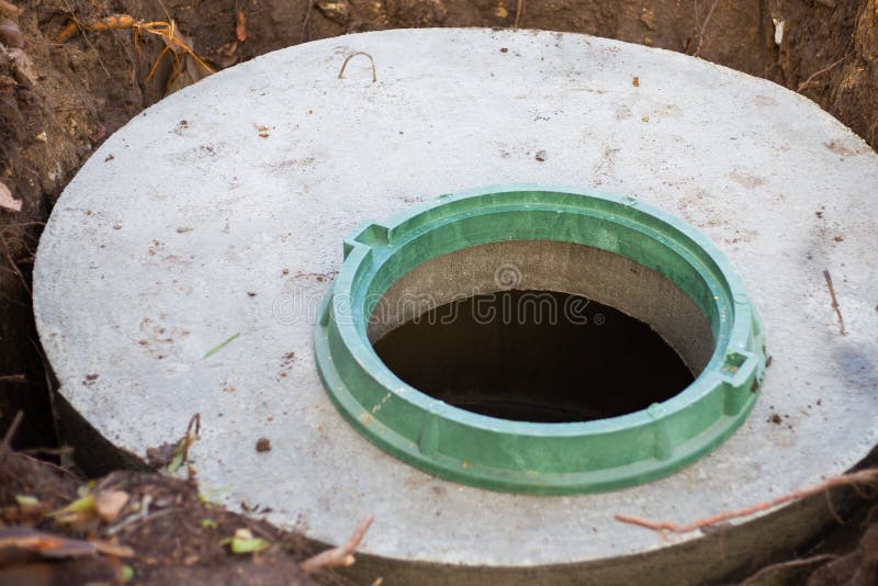 Construction of a Septic Tank. Large Concrete Rings Embedded in the ...