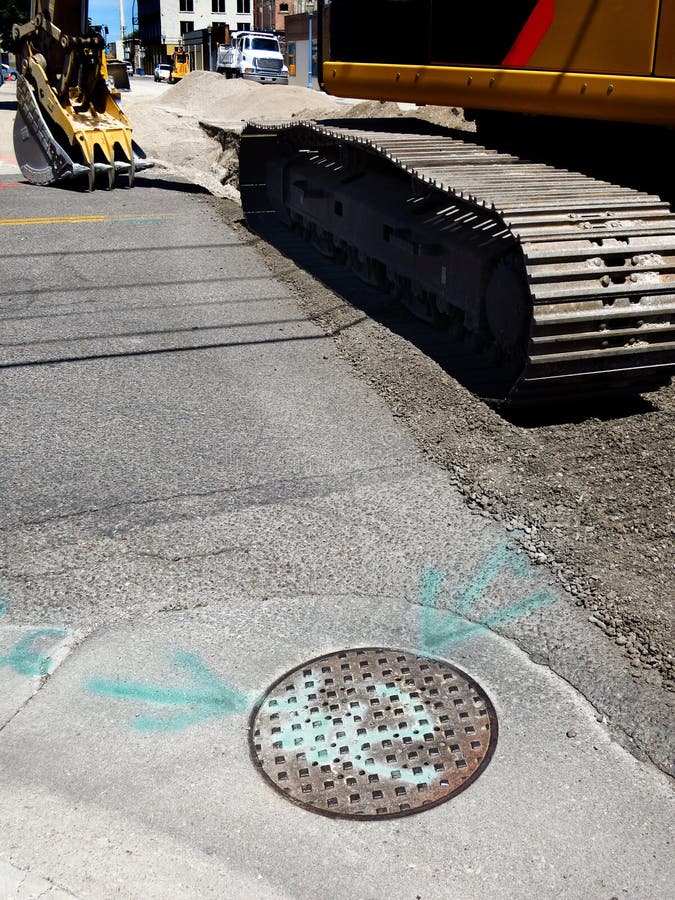 Construction on Sewer and Roadway Stock Image - Image of machinery ...
