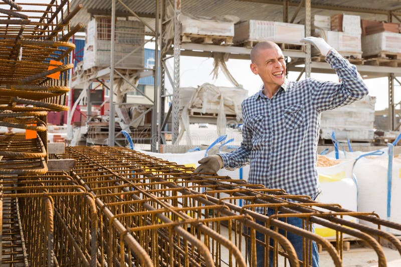 Construction Shop Worker Prepares Metal Rebar for Loading Onto Truck ...