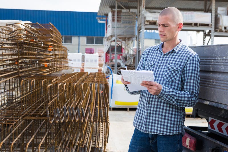 Construction Shop Worker Prepares Metal Rebar for Loading Onto Truck ...