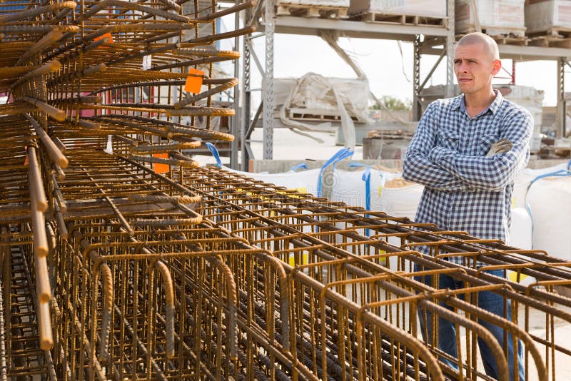Construction Shop Worker Prepares Metal Rebar for Loading Onto Truck ...