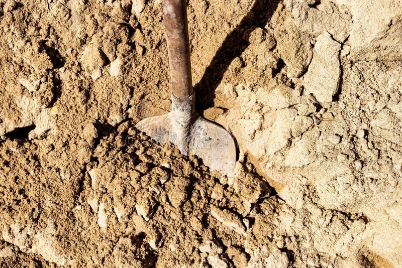 Construction Shovel in a Pile of Sand Close-up. Working Building Tool ...