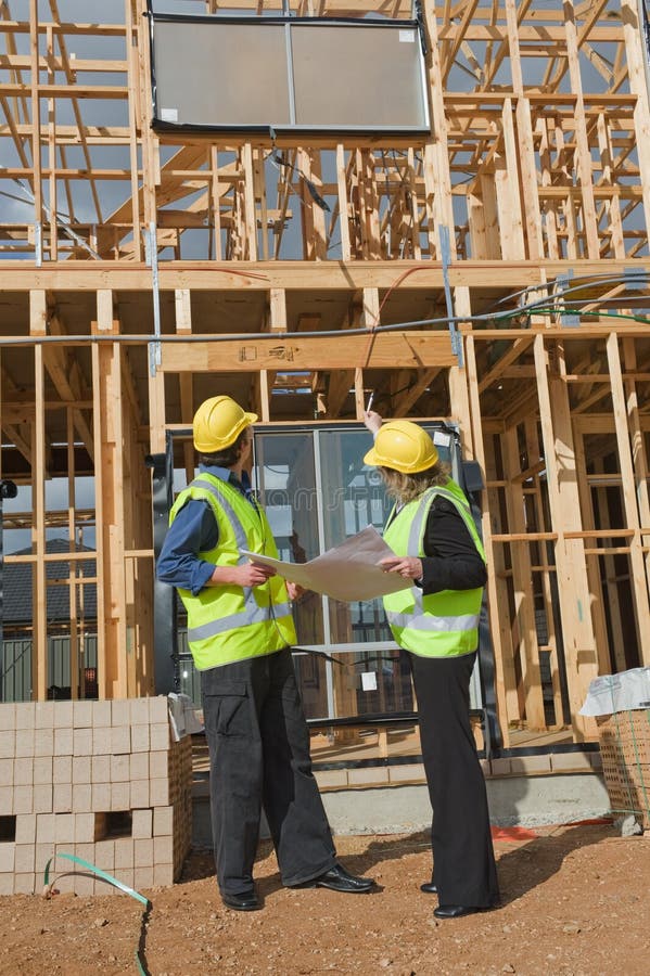 Construction Workers on the Job Building a Home Stock Photo - Image of ...