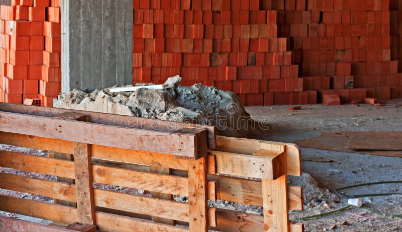 Stack of Red Building Blocks on Messy Site Stock Image - Image of ...