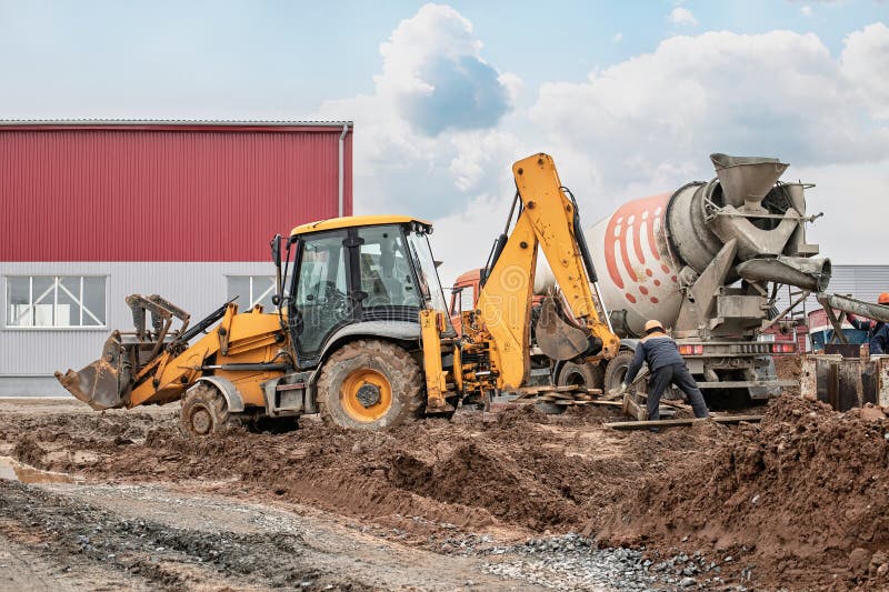 Construction Site Activity with Machinery and Workers Involved in ...