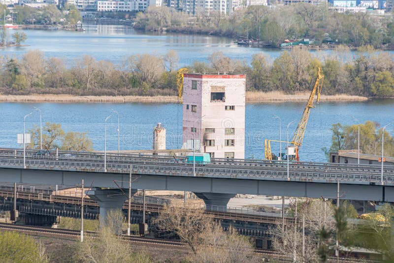 A Construction Site Along a River Bank, Featuring a Large Concrete ...