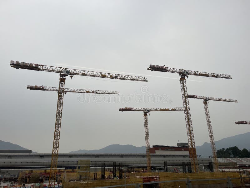Construction Site in Asia Bustling with Activity As Multiple Cranes are ...