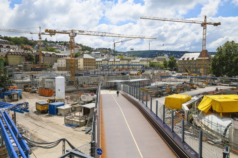 A Construction Site with a Blue Sign Displaying the Letter a on it ...