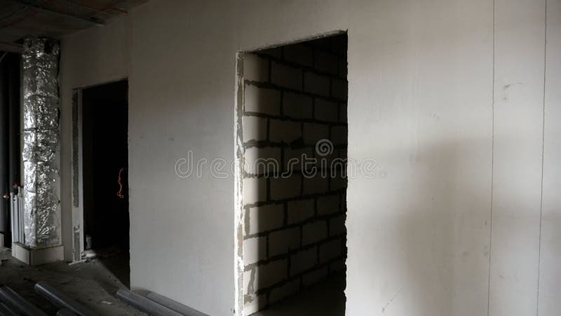Construction Site with Brick Wall and Unfinished Interior Walls Stock ...