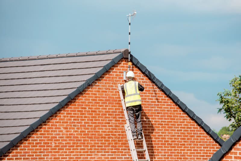 Construction Site Builder Climbing on the Ladder on Working on Hight ...