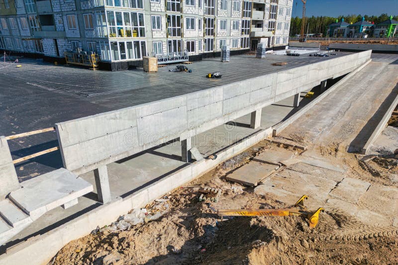 Construction Site with a Building in Progress and Machinery Near a Road ...