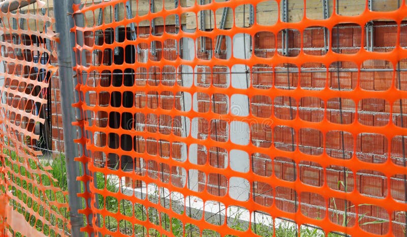 Construction Site for a Building Surrounded by an Orange Protective ...