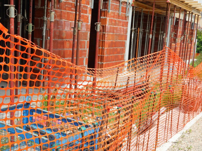 Construction Site for a Building Surrounded by an Orange Protective ...