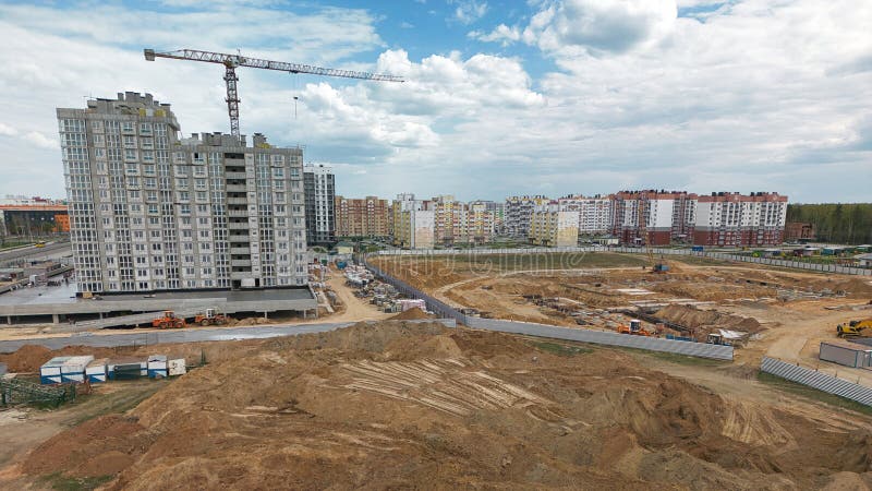 A Construction Site Buzzing with Activity As a Crane Stands Tall in the ...
