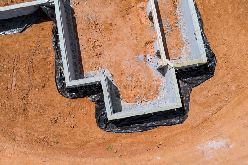 On the Construction Site, Cement Blocks are Laid for the Walls that ...