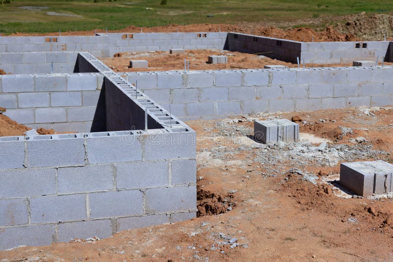 At a Construction Site, Cement Blocks Support Foundation for Wall of ...